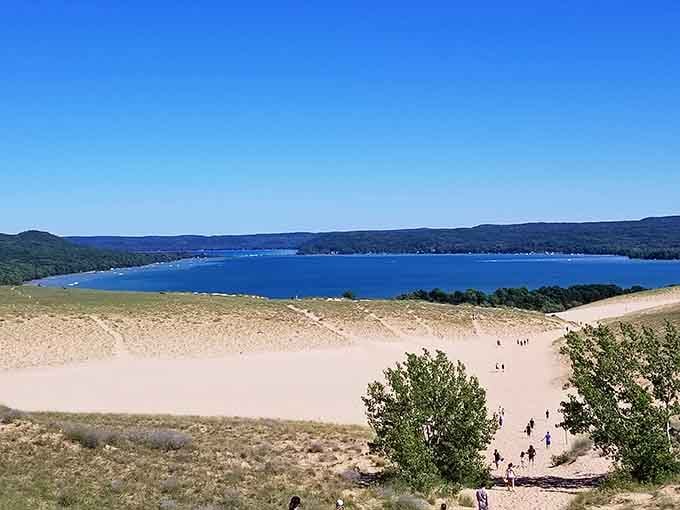 Those tiny figures climbing the massive dune prove that some adventures are worth every grain of sand.
