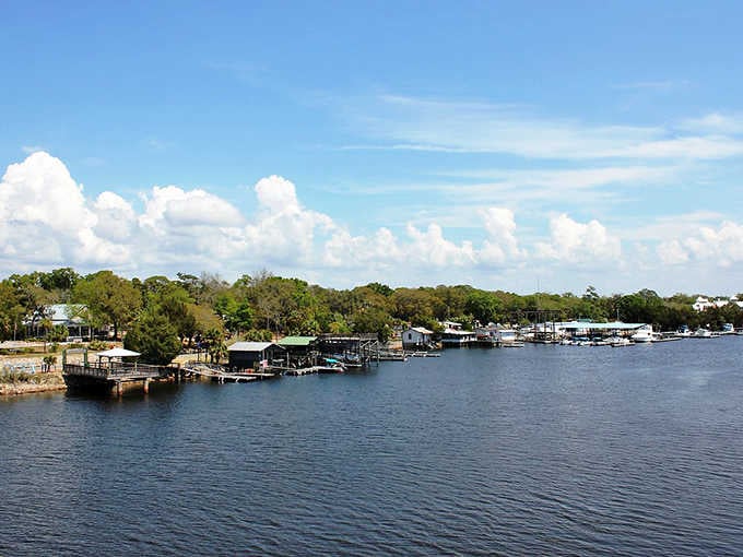 Those puffy clouds reflected in mirror-calm water create double the beauty at this timeless riverside retreat.