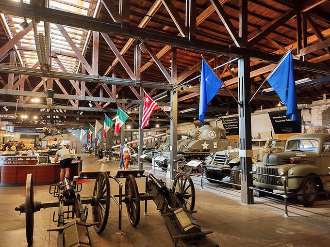 Inside, tanks and flags create a cathedral of courage where history stands at attention under soaring beams.