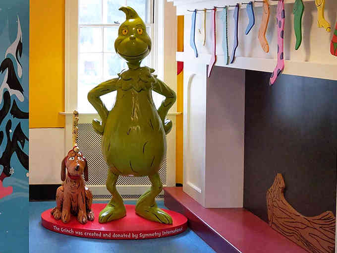 The Grinch stands guard with his faithful companion, creating the perfect photo op in this wonderfully wacky Seussian world.