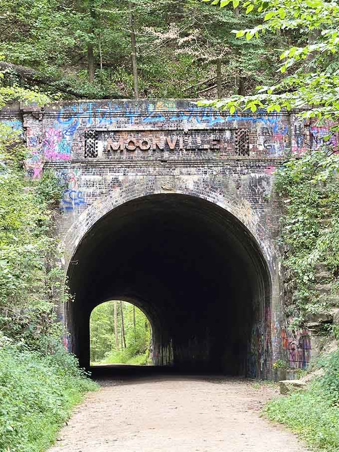 The "Moonville" lettering above the entrance stands as a haunting reminder of a town that simply vanished into the forest.