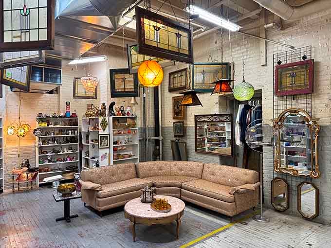 That curved sectional has hosted decades of conversations, and those stained glass windows have stories to tell.