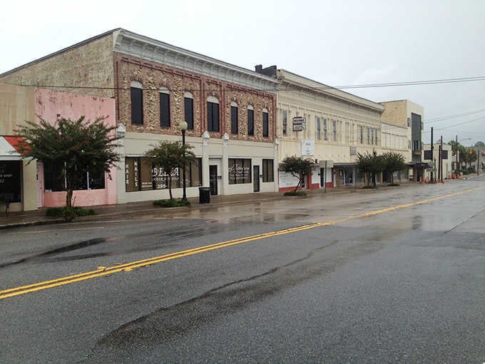 Rain-slicked streets reflect weathered facades where time moves slower and authenticity still means something real.