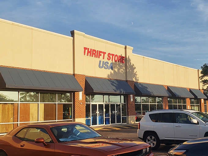 Golden hour light bathes this thrift paradise where yesterday's castoffs become tomorrow's cherished finds waiting inside.