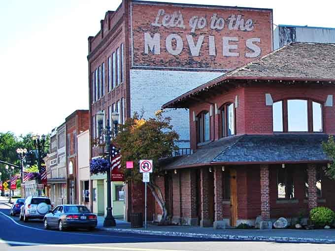 That "Let's go to the MOVIES" mural isn't just nostalgia&mdash;it's a reminder when entertainment meant community, not streaming alone.