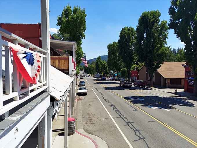 Patriotic bunting decorates historic storefronts where the pace is slower and conversations last longer than your morning coffee.