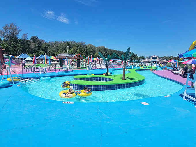 Floating through this winding lazy river under blue skies feels like pure summer bliss captured perfectly.