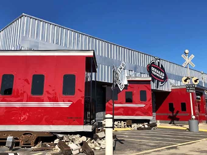 The gleaming red train car catches the sunlight like a beacon for hungry travelers seeking adventure.
