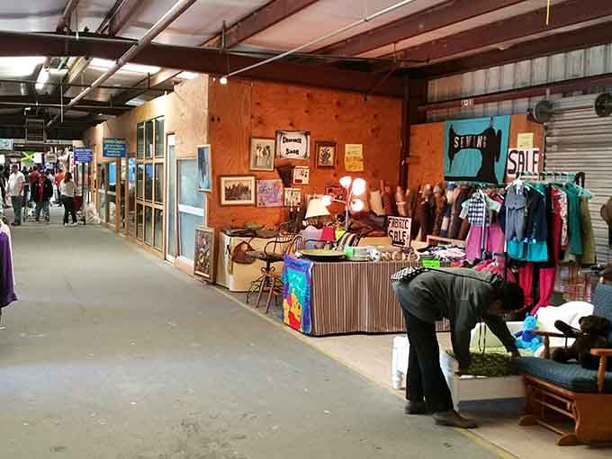 Indoor booths overflow with vintage finds and colorful clothing, creating a treasure hunter's paradise under one roof.
