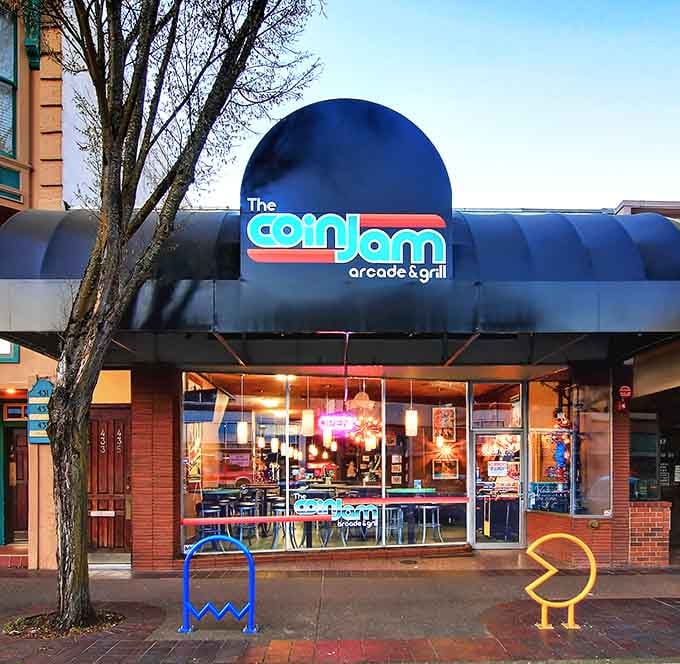 Even the exterior screams retro fun, complete with Pac-Man and ghost sculptures guarding the entrance like nostalgic sentries.