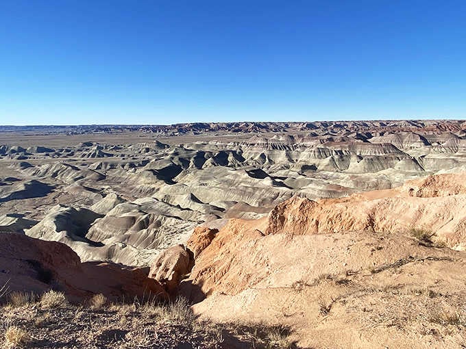 The striped badlands stretch endlessly, proving that sometimes the best things in life really are free and crowd-free.