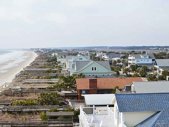 Beach houses on stilts, weathered by time and salt air into something more honest than any fresh paint job.