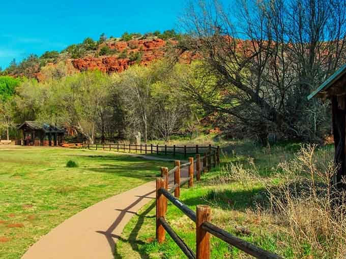 Paved pathways wind through cottonwood groves where shade actually exists, making this the rare Arizona hike that won't melt you.