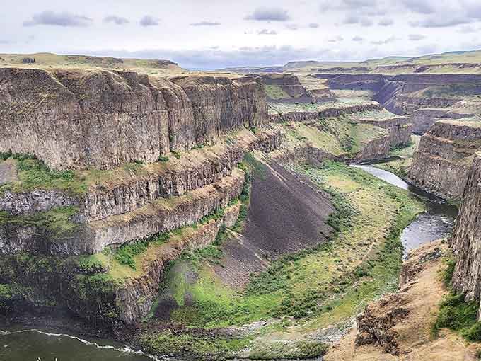 Basalt cliffs curving along the river like ancient fortress walls guarding Washington's best-kept geological secret.