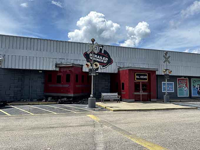 Railroad crossing signs and vintage charm make this parking lot feel like a destination, not a pit stop.