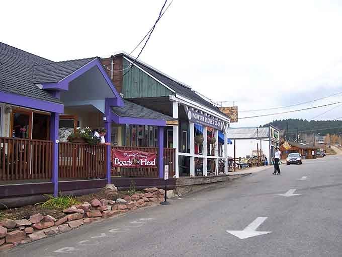 Purple porches and wooden railings create the kind of Main Street Norman Rockwell would've loved painting.