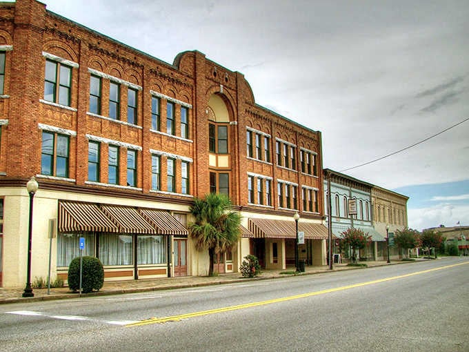 Palm trees and ornate brickwork create an unexpected architectural harmony that defines this charming Southern crossroads.