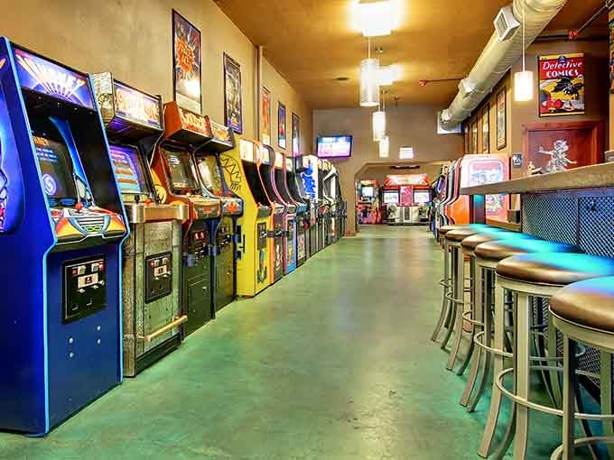 Rows of classic arcade cabinets line up like old friends waiting to challenge you to one more round.