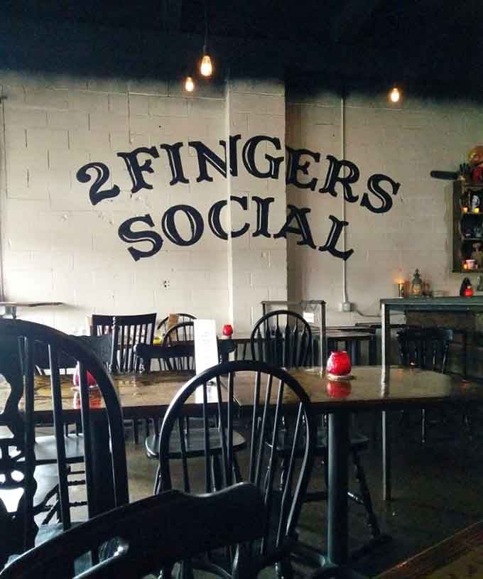 Dark wood, warm bulbs, and bold lettering, this is exactly what a neighborhood bar should feel like.