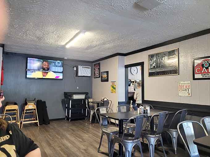 Metal chairs and vintage posters create the perfect setting where comfort food meets genuine small-town hospitality every single day.