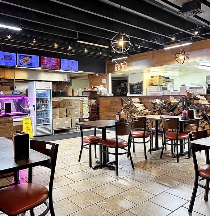 Wood-paneled walls and stacks of smoking logs create an atmosphere that says "we mean business" about barbecue.