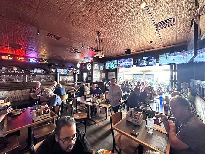 Sports on every screen, tin ceiling overhead, and the buzz of happy diners awaiting pizza perfection.