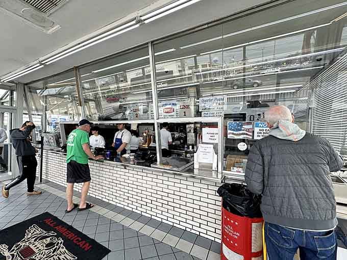 Step up to the white-tiled counter and watch the magic happen, burgers made fast, fresh, and with serious purpose.