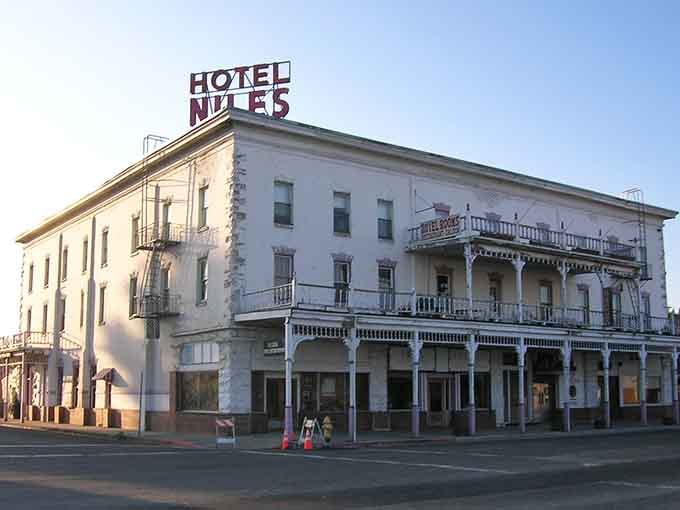 The Niles Hotel stands proud on Main Street, a white beacon of Old West hospitality that's seen better haircuts than yours.