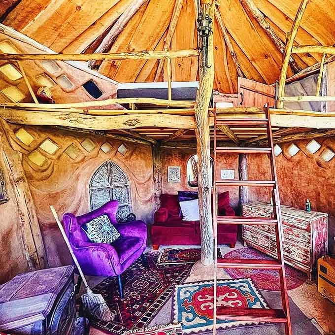 Purple velvet meets rustic wood in an interior that's equal parts whimsy and surprisingly sophisticated mountain retreat.