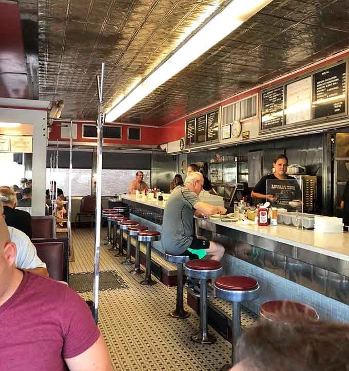 Chrome stools and a counter that's witnessed more life stories than a therapist's notebook.