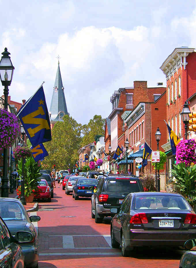 Main Street blooms with hanging baskets and Maryland pride, proving small-town charm never goes out of style.