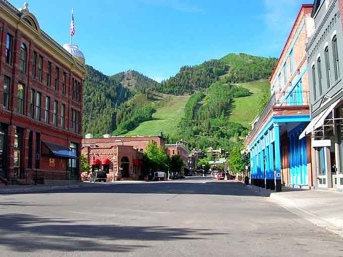 Historic buildings meet mountain majesty on this picture-perfect street where every view deserves its own postcard.