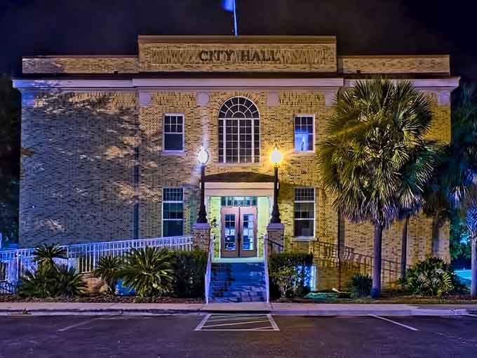 City Hall glows like a beacon at night, proving small-town government buildings can have more character than most big-city skyscrapers combined.