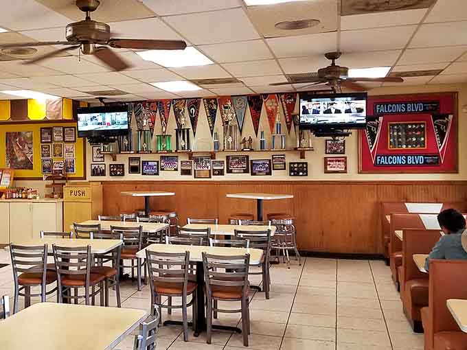 Sports memorabilia and comfortable seating create the perfect backdrop for your upcoming food coma of joy.
