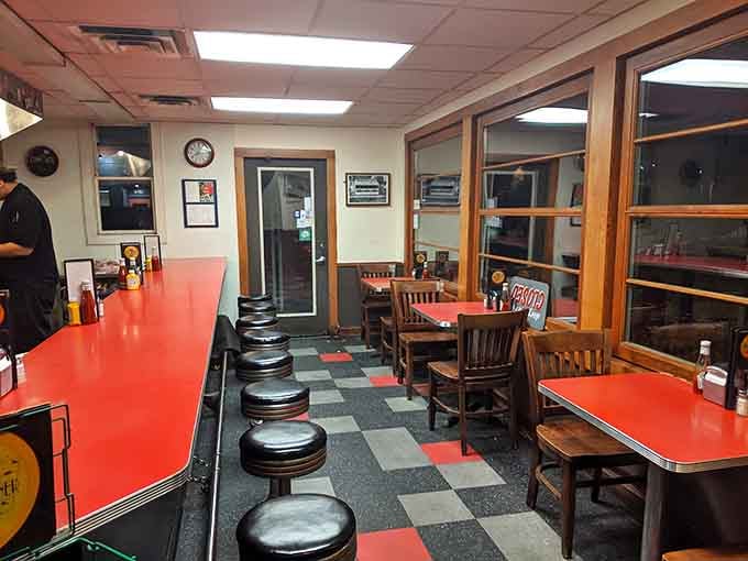 Chrome stools and checkered floors prove that some design choices are timeless for very good reasons.