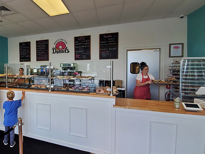 Behind that counter, magic happens daily as fresh donuts emerge to brighten your entire week.