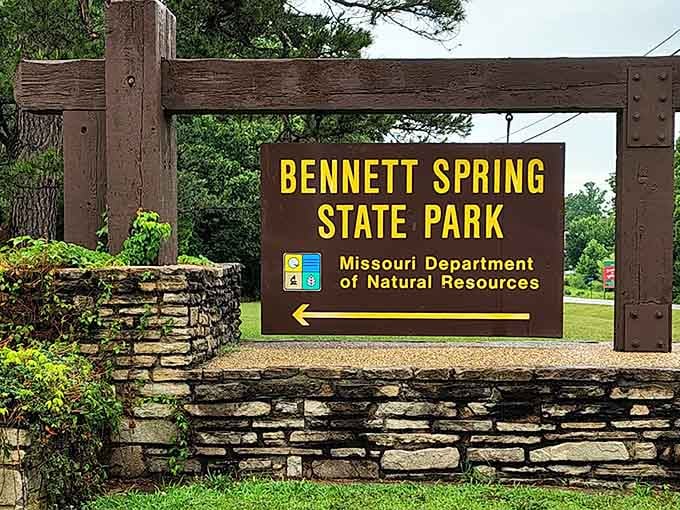When the sign's built from Depression-era stonework, you know this place has stories older than your favorite fishing rod.