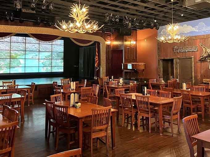 Those antler chandeliers and wooden tables create an atmosphere where every meal feels like a special occasion worth remembering.