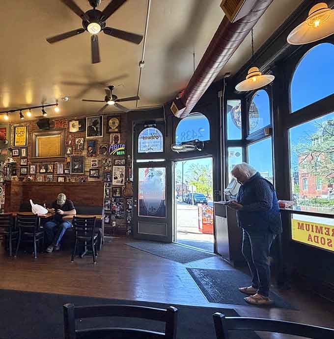 Natural light pours through those arched windows like a spotlight on your lunch, illuminating what's about to be magic.