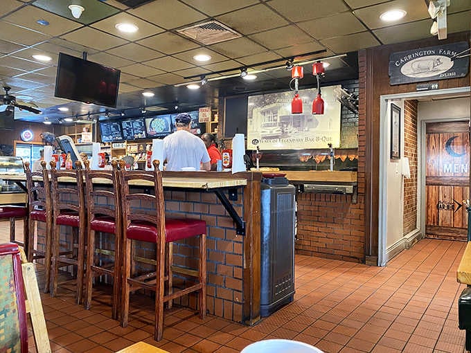 The brick-lined counter and warm lighting create the perfect stage for barbecue magic to happen daily.