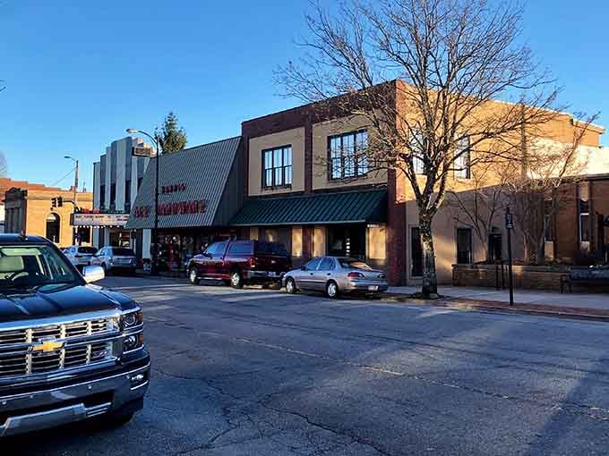 Main Street Brevard at golden hour proves small-town charm isn't extinct, just patiently waiting in the mountains for you.
