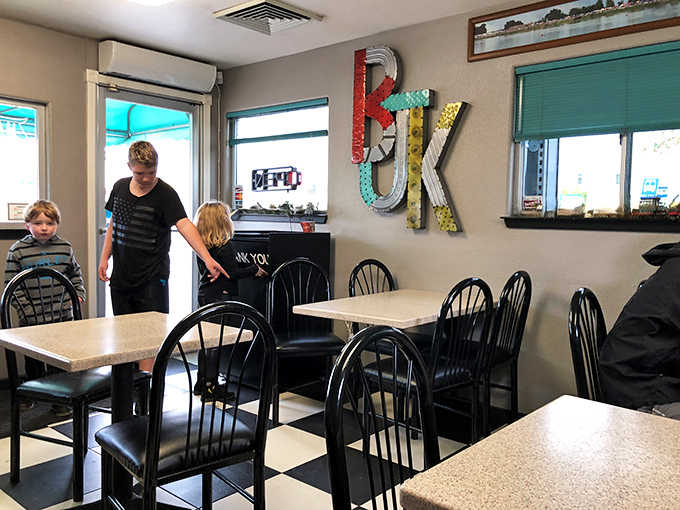 Inside, colorful letters spell out what matters most while families gather around tables that remember multiple generations.