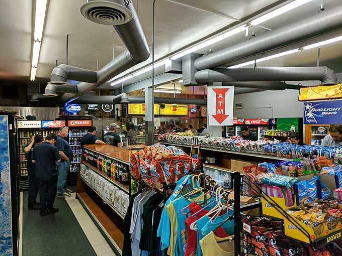 Inside Busy Bee Market, exposed ductwork meets deli counter magic where sandwich dreams become delicious reality.