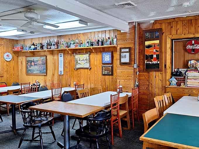 Wood paneling and mismatched chairs create the kind of cozy atmosphere where strangers become friends over shared meals.
