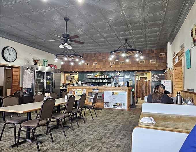 The tin ceiling and warm lighting create an atmosphere that whispers "stay awhile" louder than any hostess ever could.