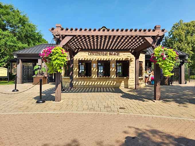 Those flowering vines framing the entrance aren't just pretty, they're your first hint this isn't your average municipal pool experience.