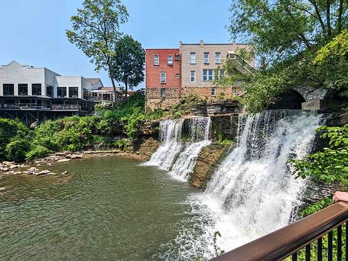Water cascades over rocky ledges right in the heart of downtown, proving nature doesn't need permission to steal the show.