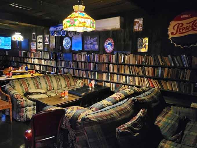 Books floor to ceiling and plaid couches create the ultimate hangout spot you wish existed in college.