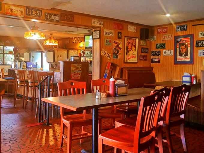Wood paneling, license plates, and vintage Coca-Cola signs create the perfect time-capsule dining experience you didn't know you needed.
