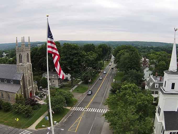 Newtown's charming downtown, where church steeples and tree-lined streets create picture-perfect New England vibes.